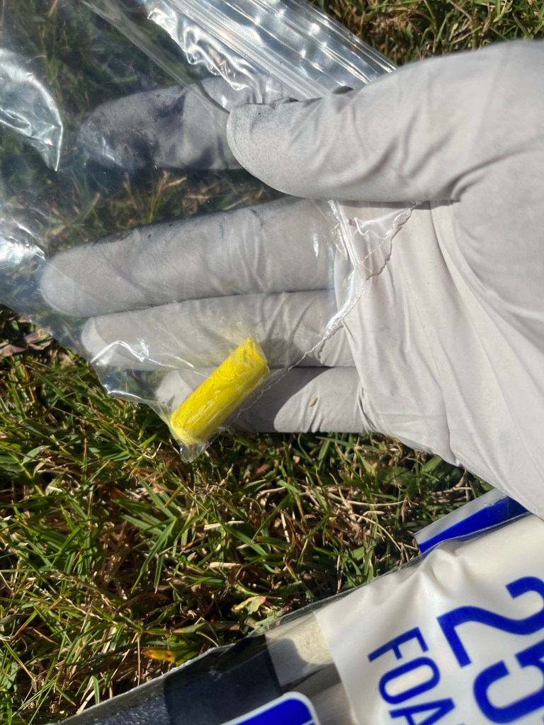 Painting a Message on a School Rock